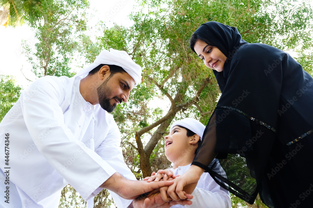 Arab team building. Arabic family having fun together. Playing Emirait ...