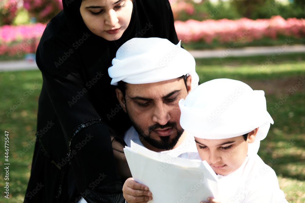 Arab team building. Arabic family having fun together. Playing Emirait ...