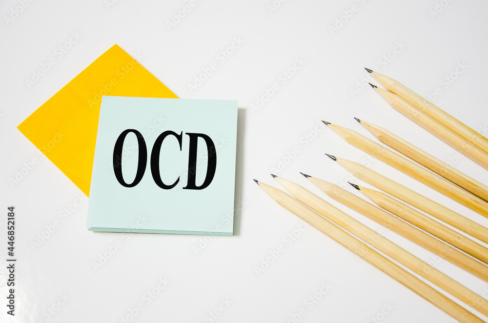 Obsessive Compulsive Disorder word written on a yellow piece of paper ...