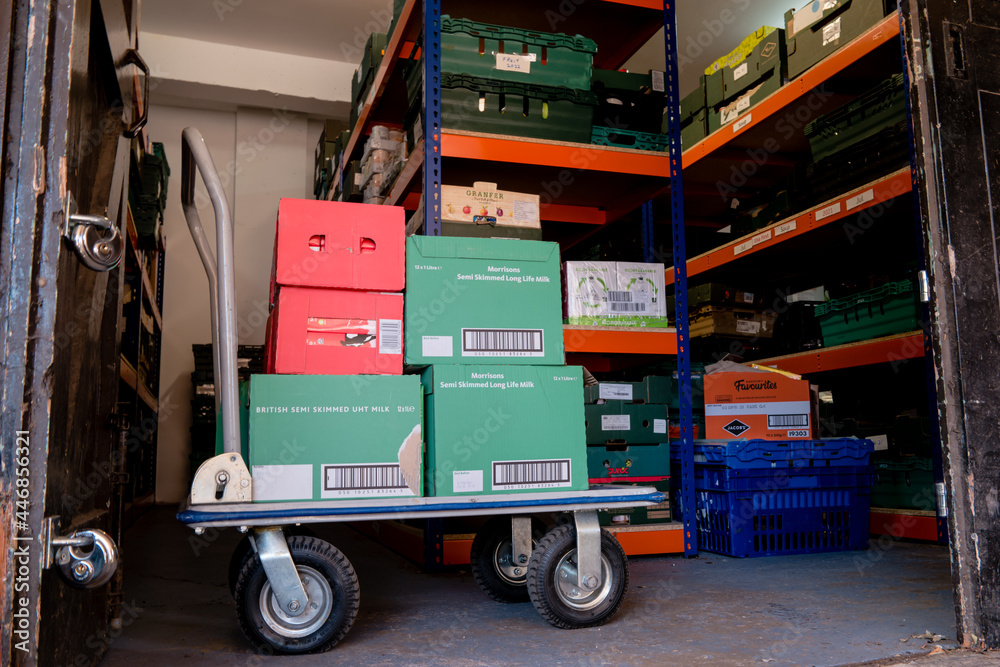 ROTHERHAM, UK – SEPTEMBER 29, 2020: Trolley of donated food and milk in ...
