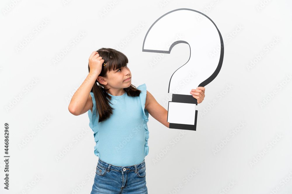 Little caucasian kid isolated on white background holding a question ...