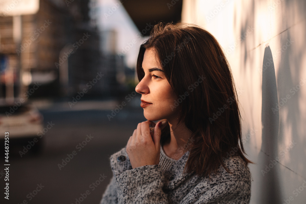 Portrait of thoughtful non-binary woman standing in city Stock Photo ...