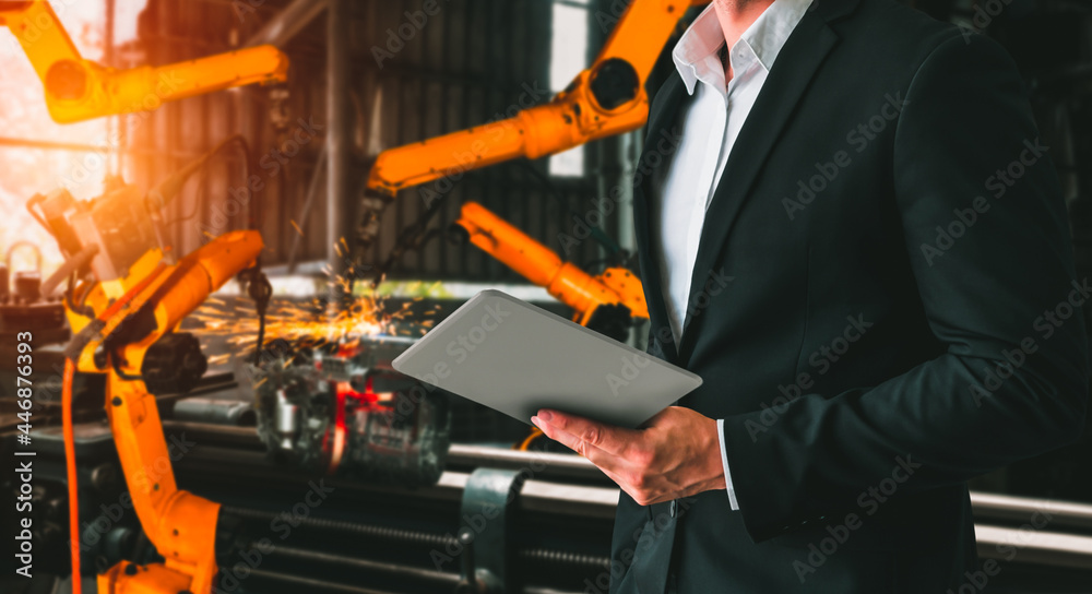 Engineer use advanced robotic software to control industry robot arm in ...