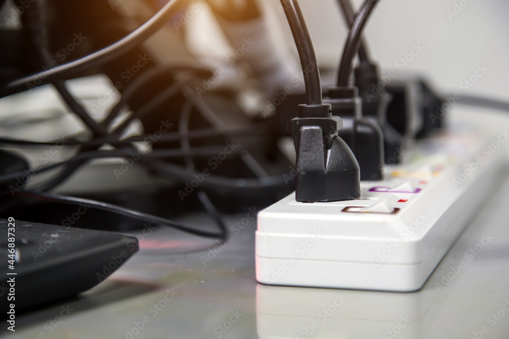 Old and damaged electric adapter power plug has many appliances are ...