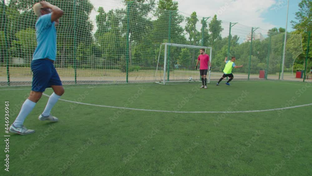 Soccer player in sportswear making right shot into penalty area where ...