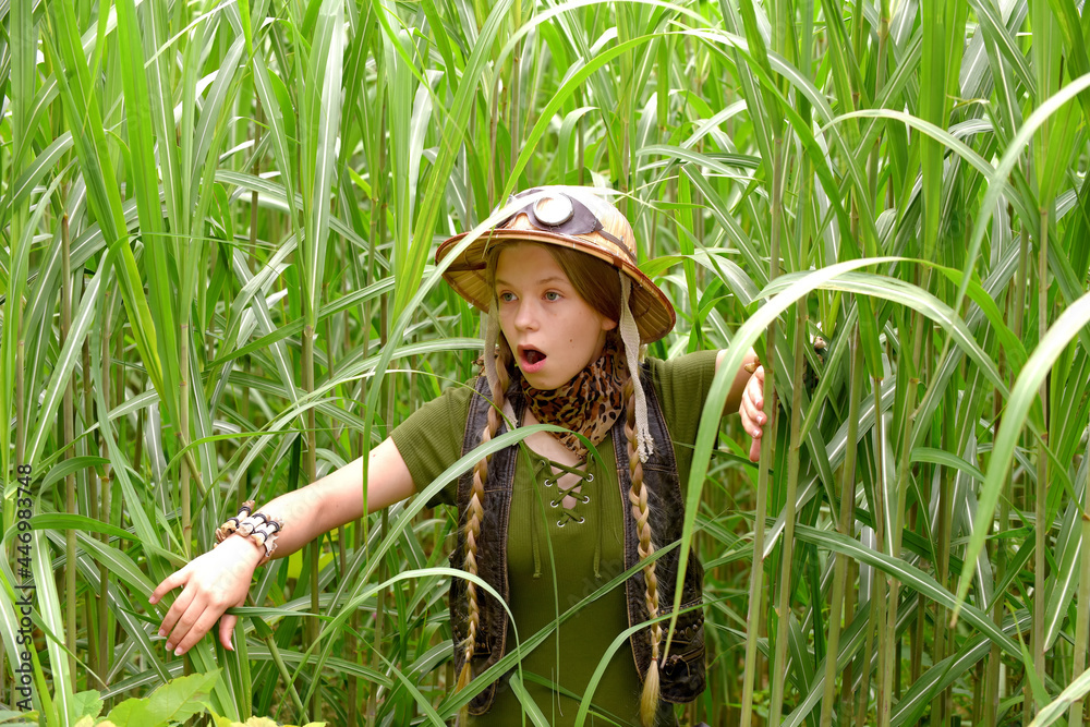 Foto de A young girl is dressed up as an explorer. She is seen in a ...