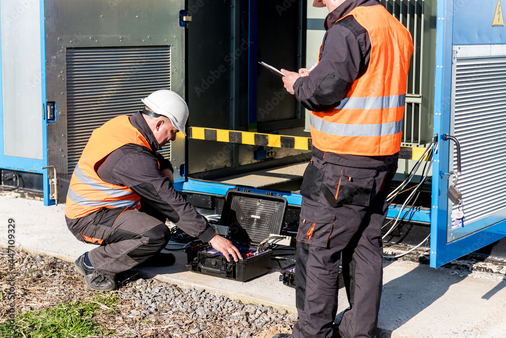 Execution of electrical measuring works on the power transformer Stock ...