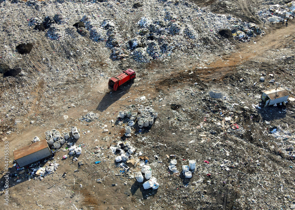 Garbage dump with food waste. Arial view of garbage truck unloads ...