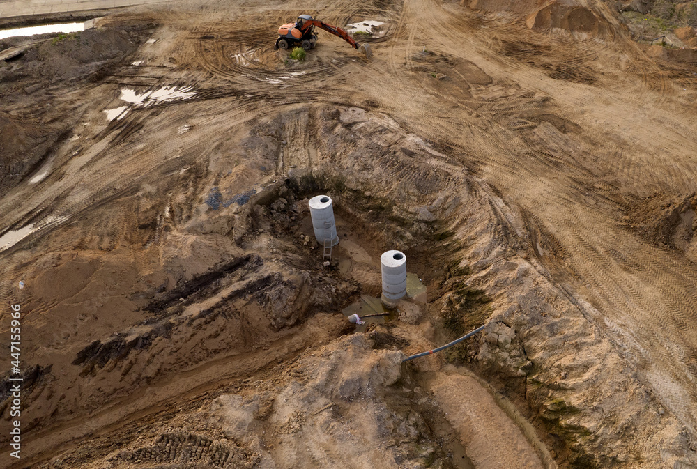 Laying of underground storm sewer pipes and sewerage wells ...