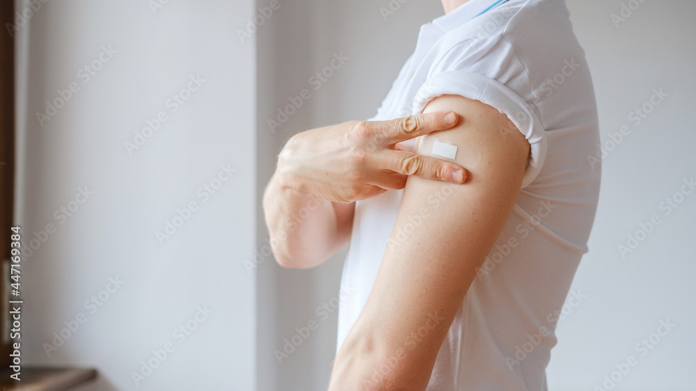 Unrecognized Vaccinated Man Showing Arm With Medical Patch Plaster ...