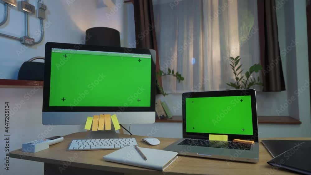 Laptop Computer and Desktop Computer Showing Green Key Screen Stands on ...