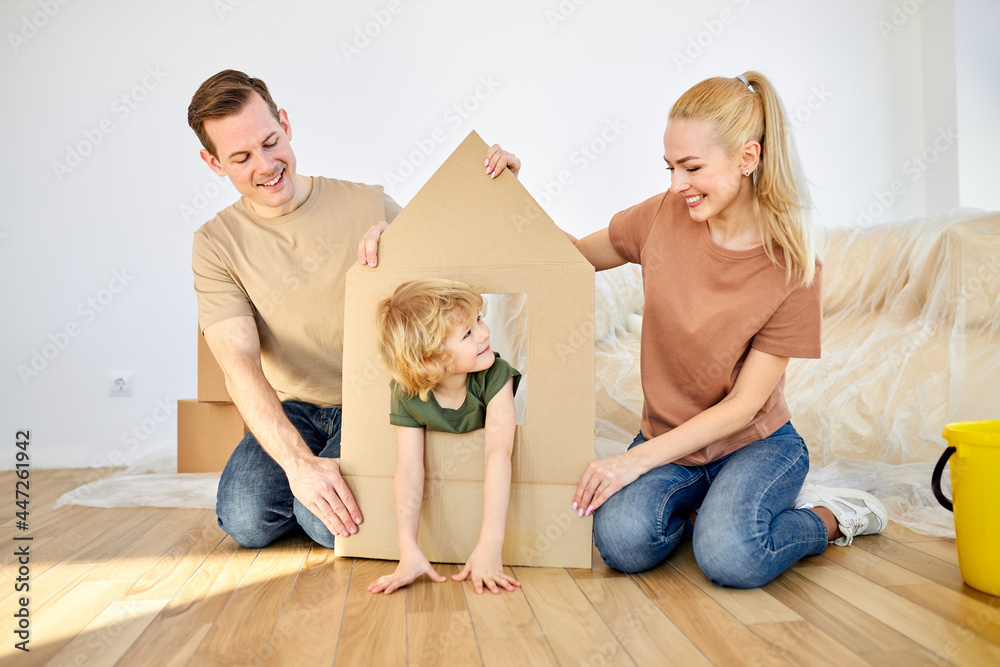 Dreams come true. cheerful family with their little son moved to new ...