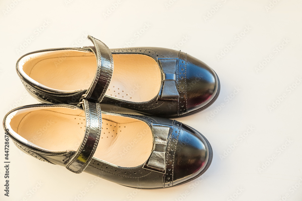 black leather shoes on white background.New leather girl student shoes ...