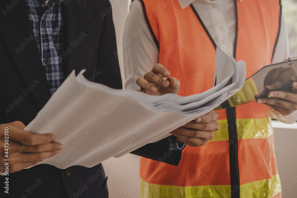 Building, builders asian young contractor man, woman inspecting ...