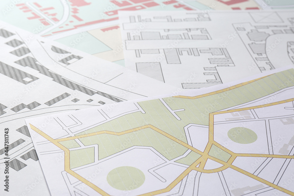 Many different cadastral maps of territory with buildings as background ...