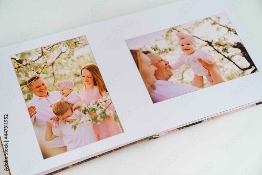 white background open photobook from family photo shoot in spring ...