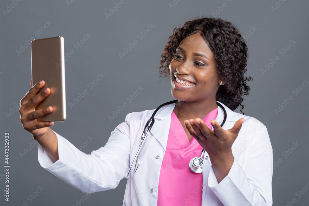 African female doctor holding phone talk to patient make telemedicine ...