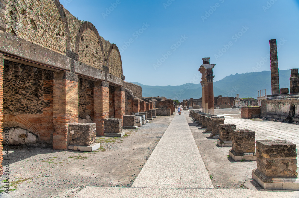 POMPEI, ITALY - JUNE 28, 2021: Tourists visit famous ruins of ancient ...