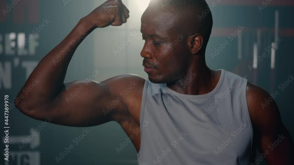 Portrait of handsome fitness black man in gym, Personal trainer show ...