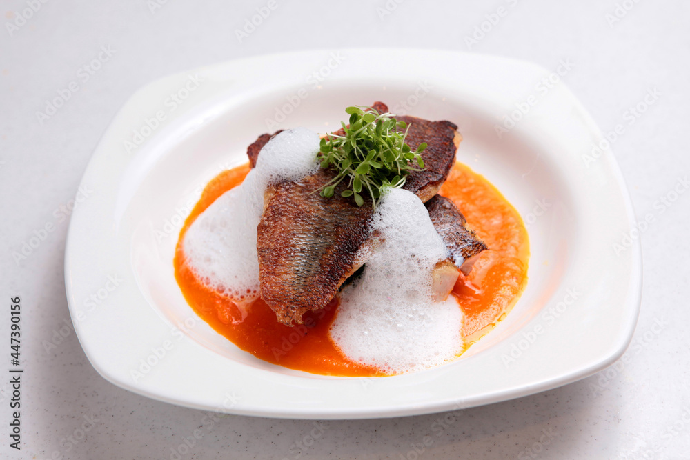 bbq grilled grouper fish fillet with special bubble red sauce in white ...