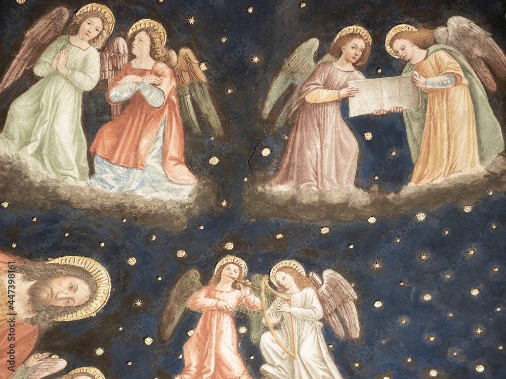 Renaissance fresco depicting angels in the starry sky on the ceiling of ...