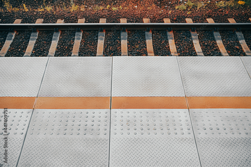 Train platform with tactile dotted pavement for handicapped people ...