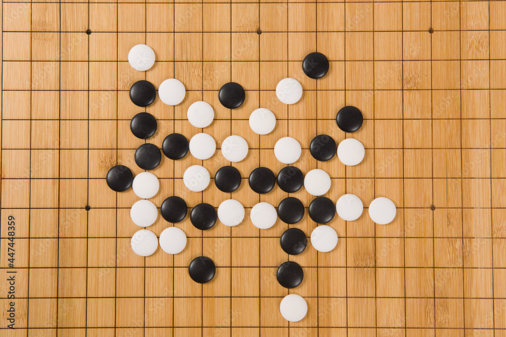 Desk for board game Go or Weiqi and black and white bones. Traditional ...