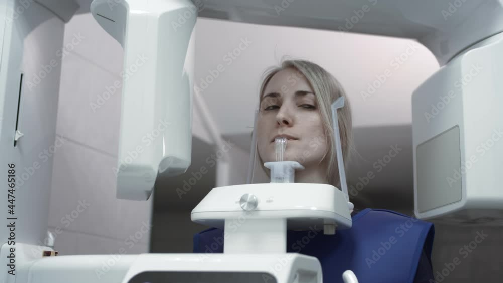Dental jaw scanning. Patient girl inside a panaromaniac 3d scanner of ...