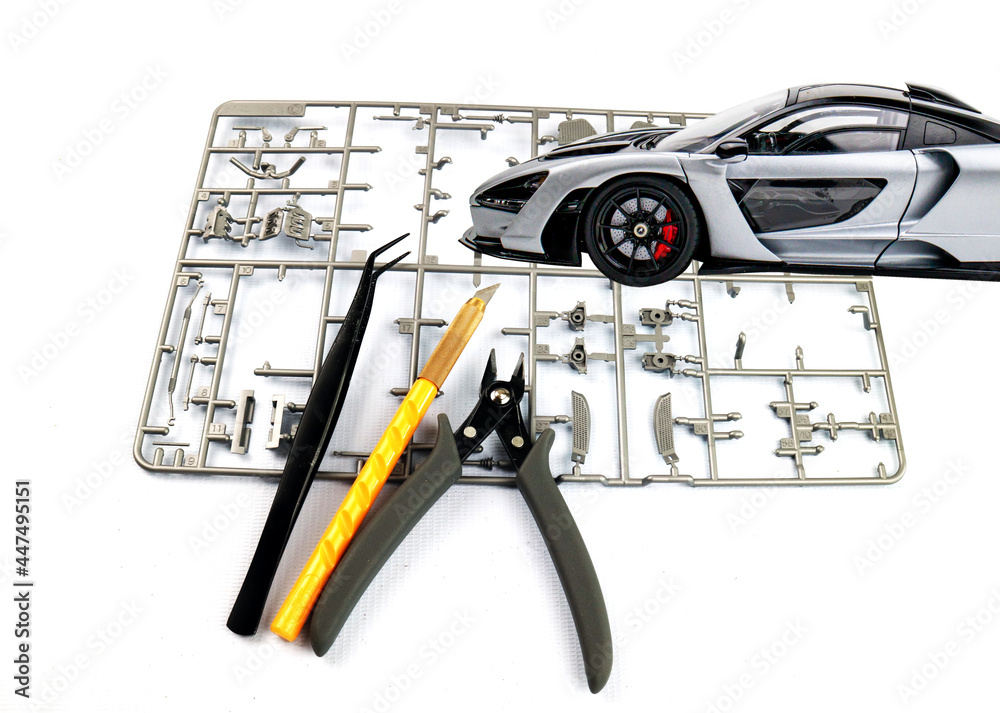 Plastic grid of parts for a scale sport car model that is delicate to ...