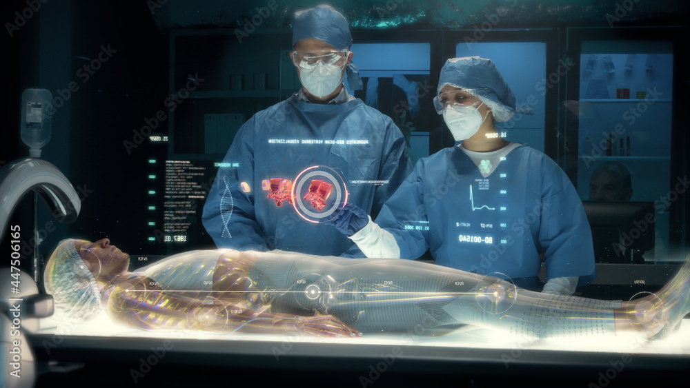 Foto de Team of surgeons perform a delicate operation using modern ...