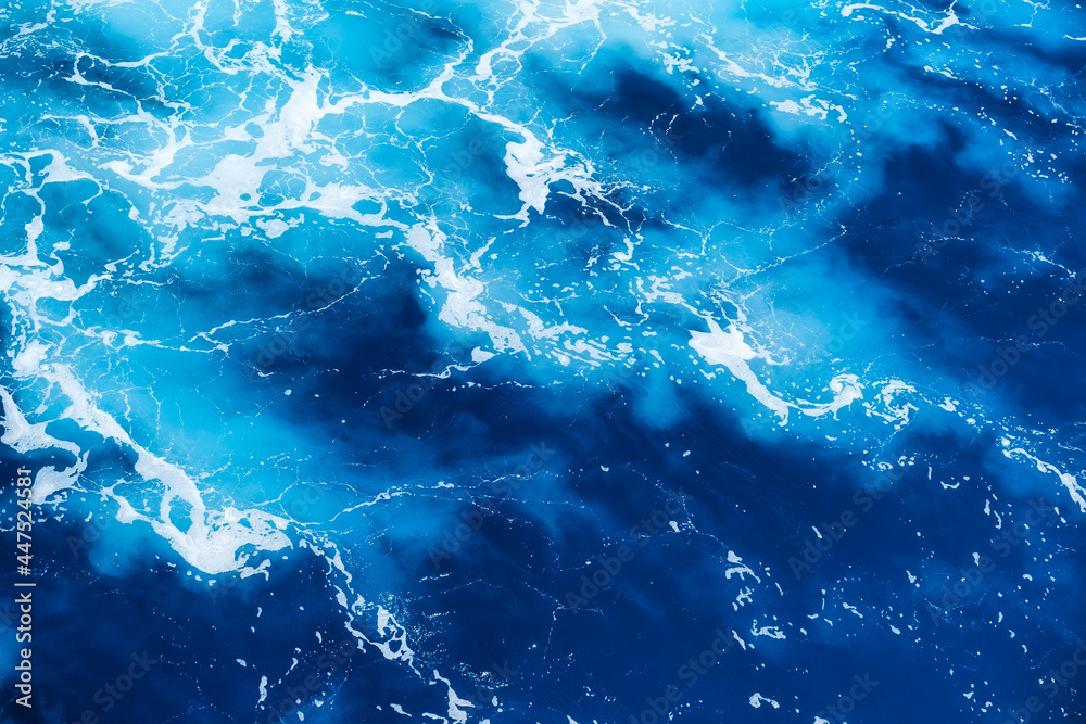 Waves and blue water as a background. View at the ocean surface ...