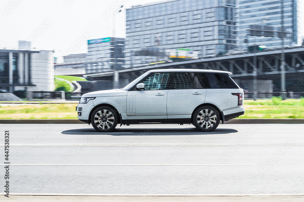 Brand new Range Rover L405 side view. Sport SUV white color driving ...