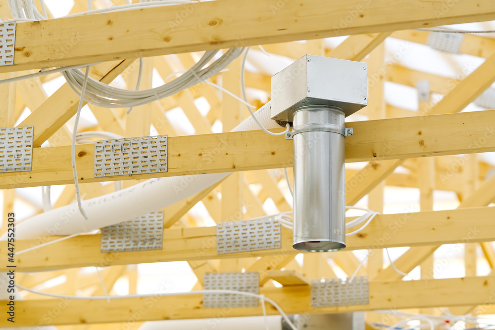 Installation of ventilation in a new timber frame house under ...