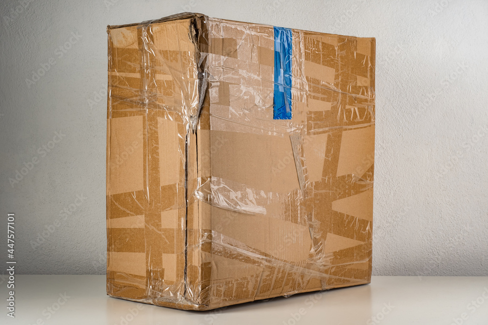 Old box. Cardboard box is sealed with tape. Concept is recycling of ...