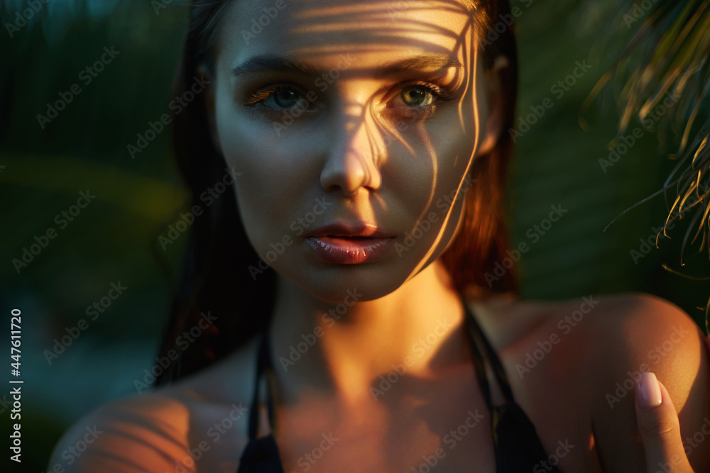 young sexy woman in bikini under palm tree Stock Photo | Adobe Stock