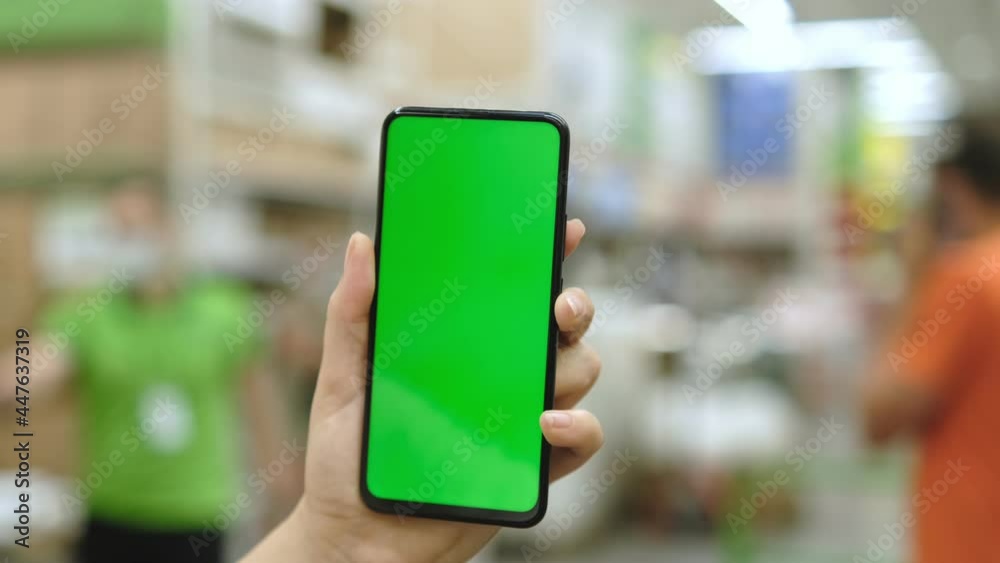 Shopping center. Mall. Department store. Back view of brunette holding ...