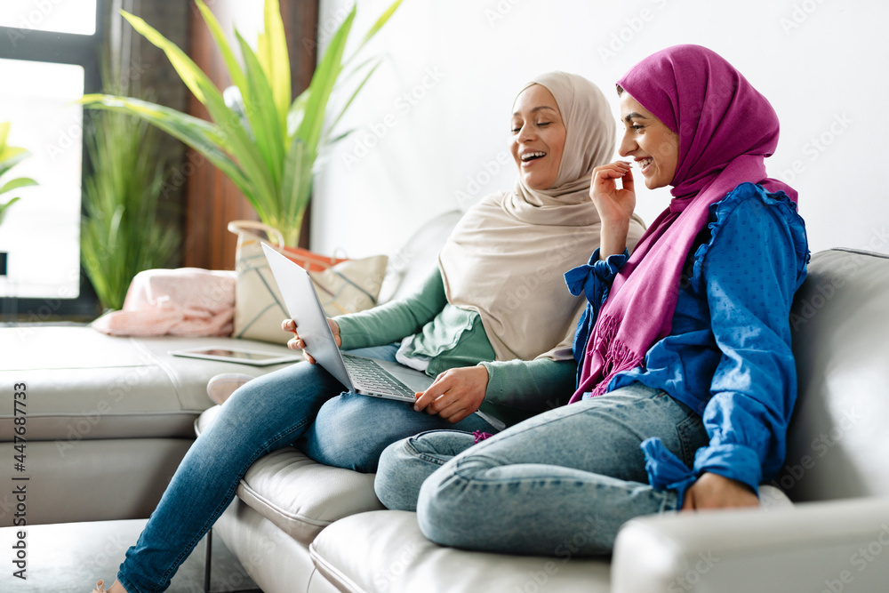 Two muslim women wearing hijab Stock Photo | Adobe Stock