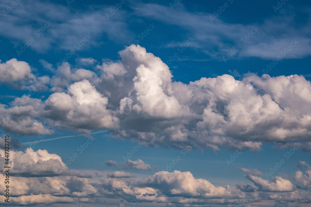 Blue sky background with big white tiny stratus cirrus striped clouds ...