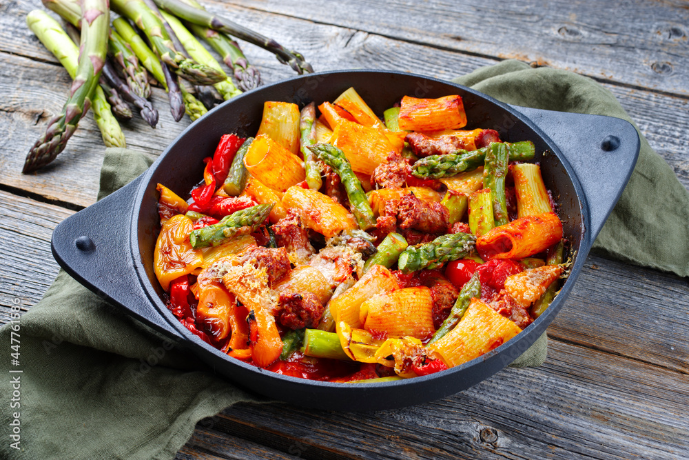 Traditional roasted Italian pasta mezzi paccheri rigati con salsiccia ...