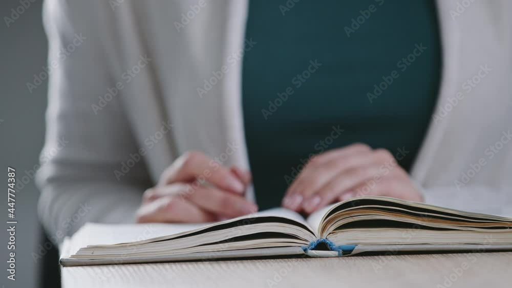 Close-up unrecognizable girl student sitting at table at university ...