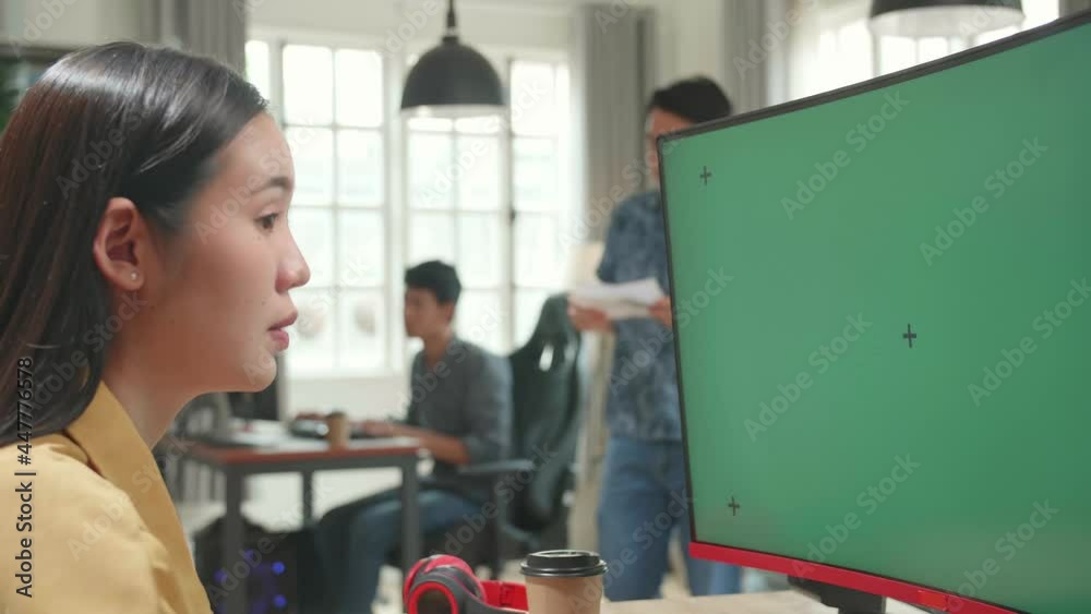 Asian Female Works With Mock Up Green Screen Computer Display In Office Stock 비디오 | Adobe Stock