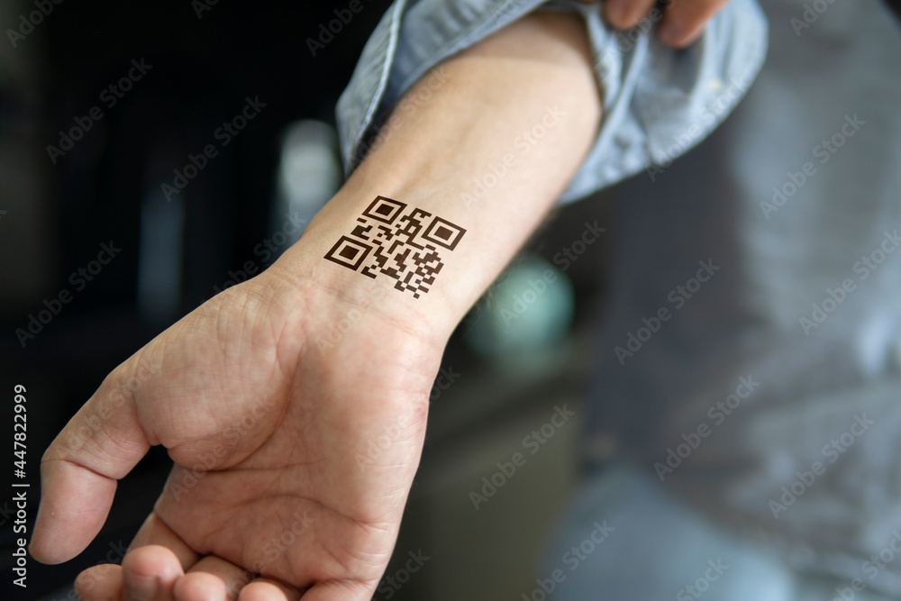 man shows his hand with a qr code, a confirmation of the vaccination ...