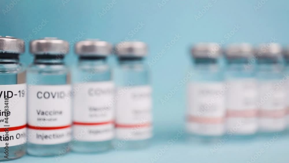Glass vials for Covid-19 vaccine in laboratory. Group of Coronavirus vaccine bottles. Medicine ...