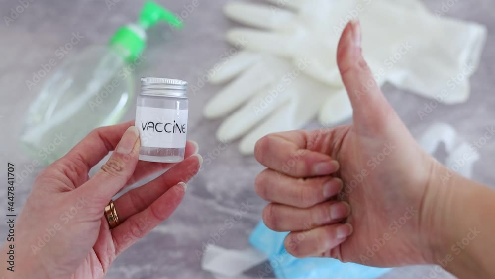 covid-19 vaccine race, hand holding vaccine ampooule with disposable ...