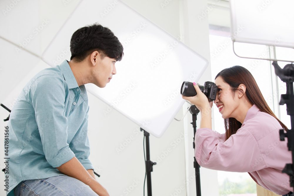Asian friendly confident long brown hair female photographer smile hold ...