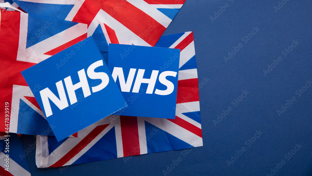 LONDON, UK - July 2021: NHS National health service logo on a union ...
