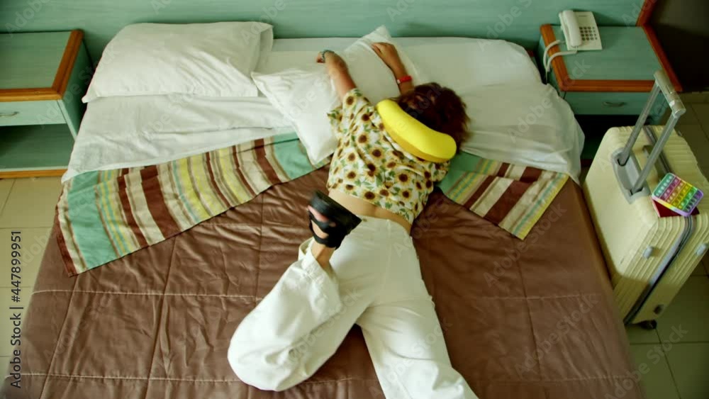 Video „a woman in a quarantined hotel is lying on the bed and out of ...