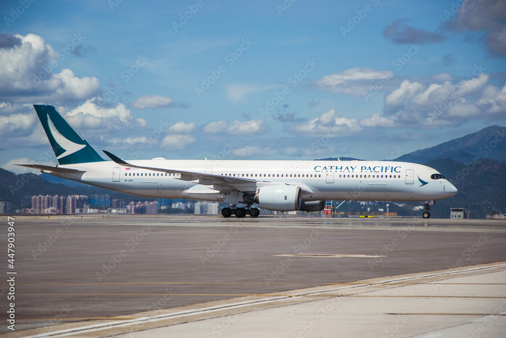 Cathay Pacific plane taxiing on ground at Hong Kong International ...