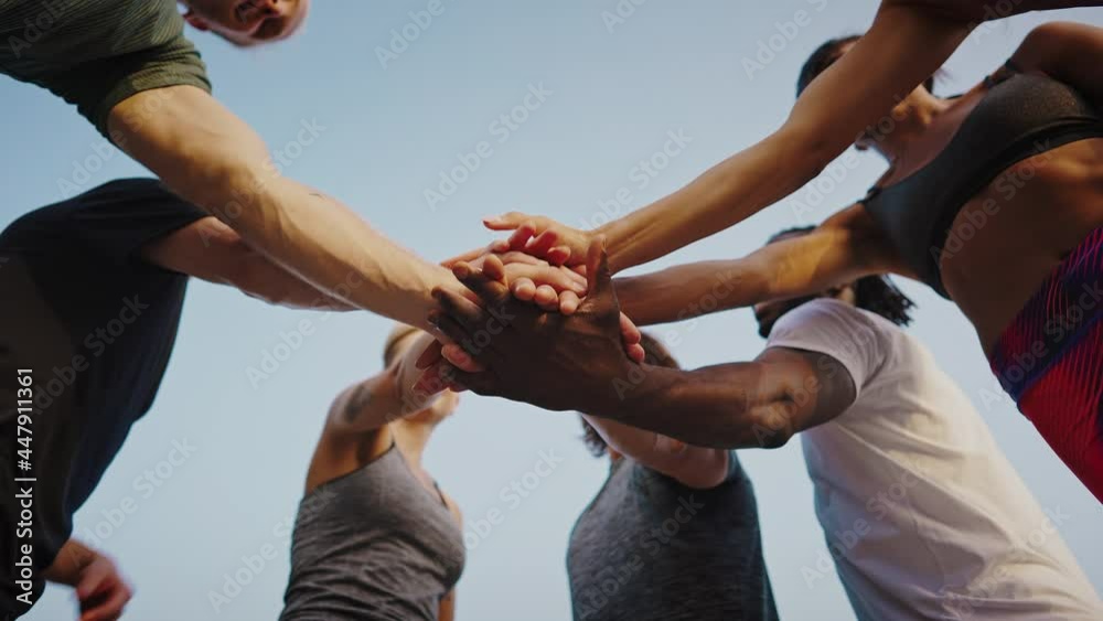 Young beautiful group of sportswomen standing shaking hands after after ...