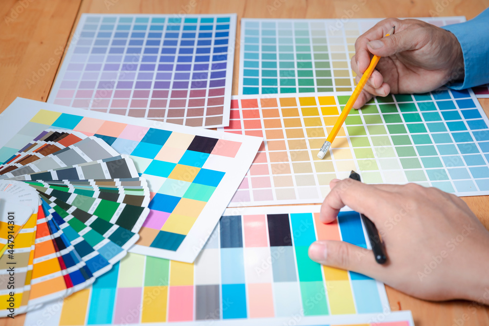 Interior designer chooses a color chart for home design. Graphic ...